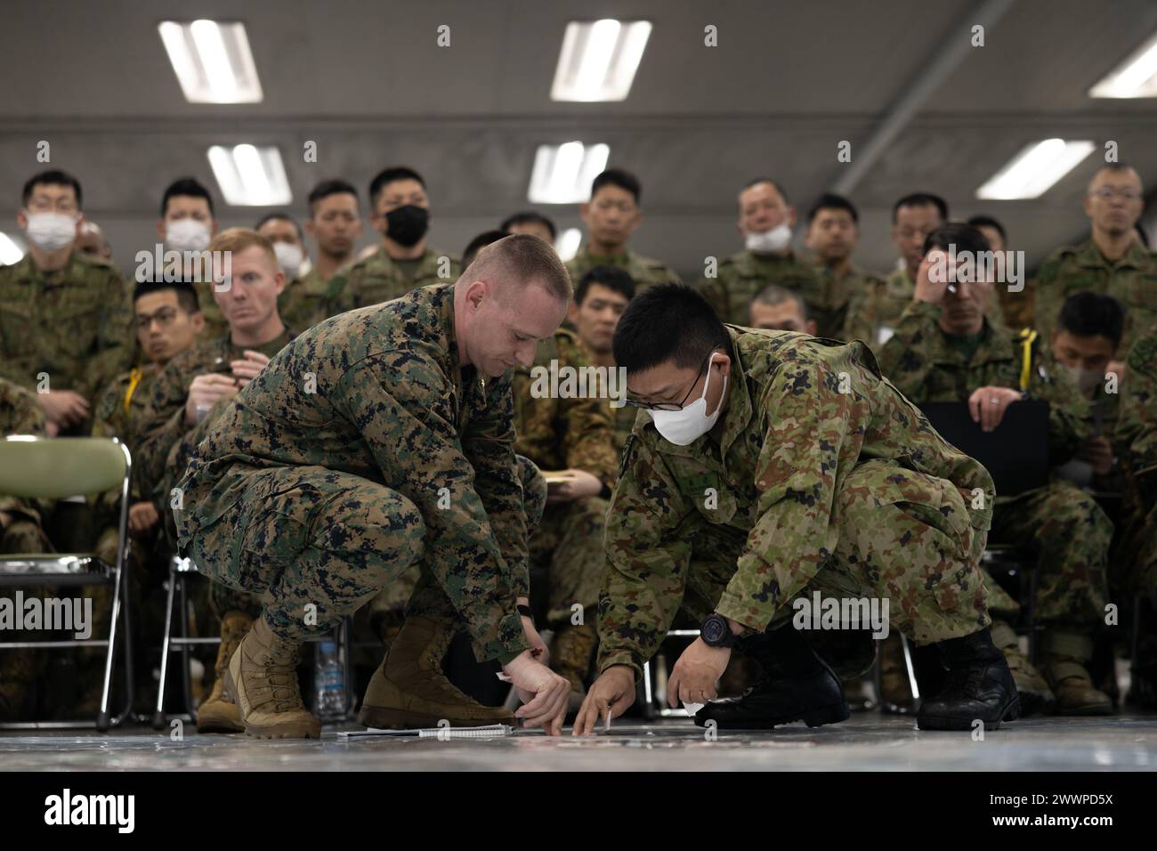 U.S. Marine Corps Maj. Aaron Davidson, left, the fire support ...