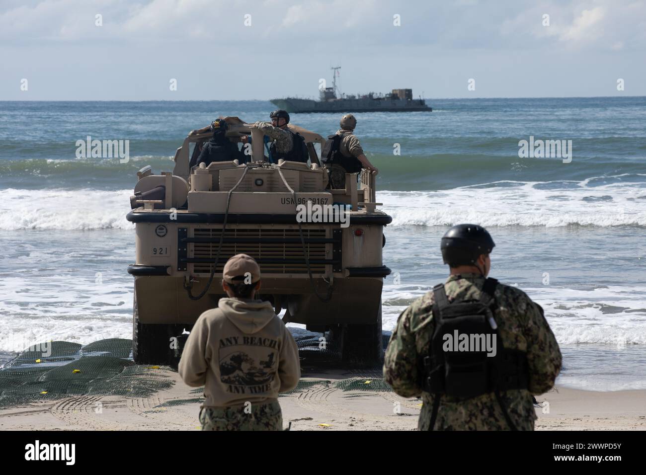 U.S. Navy Sailors, assigned to Beachmaster Unit 1, conduct a series of ...