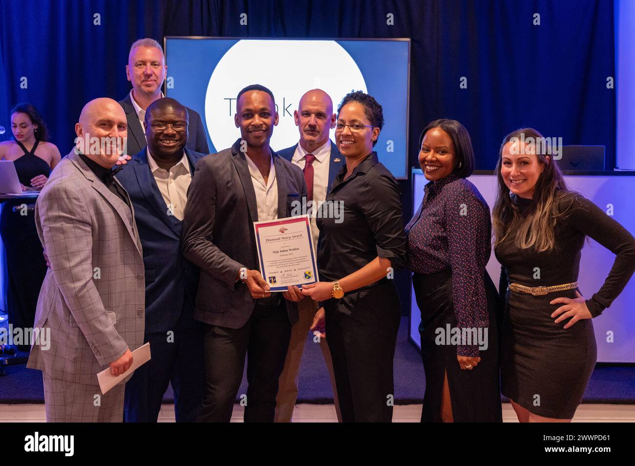 Staff Sgt. Julian Weldon receives the Diamond Sharp Award from the ...