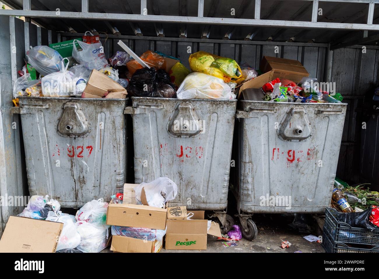 overfilled public trash bins at summer day in Bishkek, Kyrgyzstan Stock ...