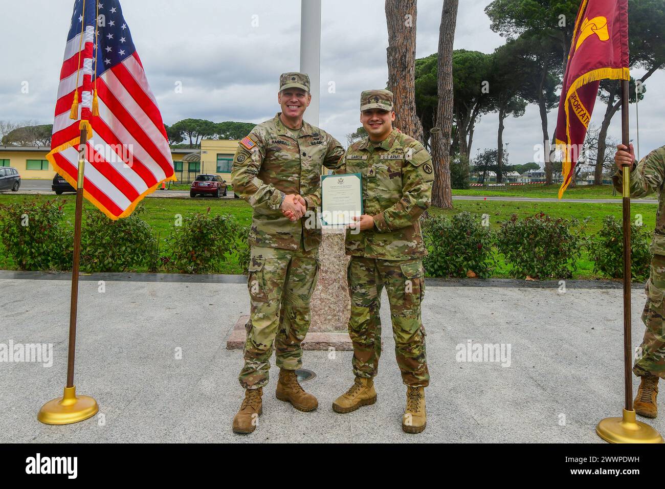 Left, U.S. Army Lt. Col. Michael S. Harrell commander of 839th Transportation Battalion presents ...