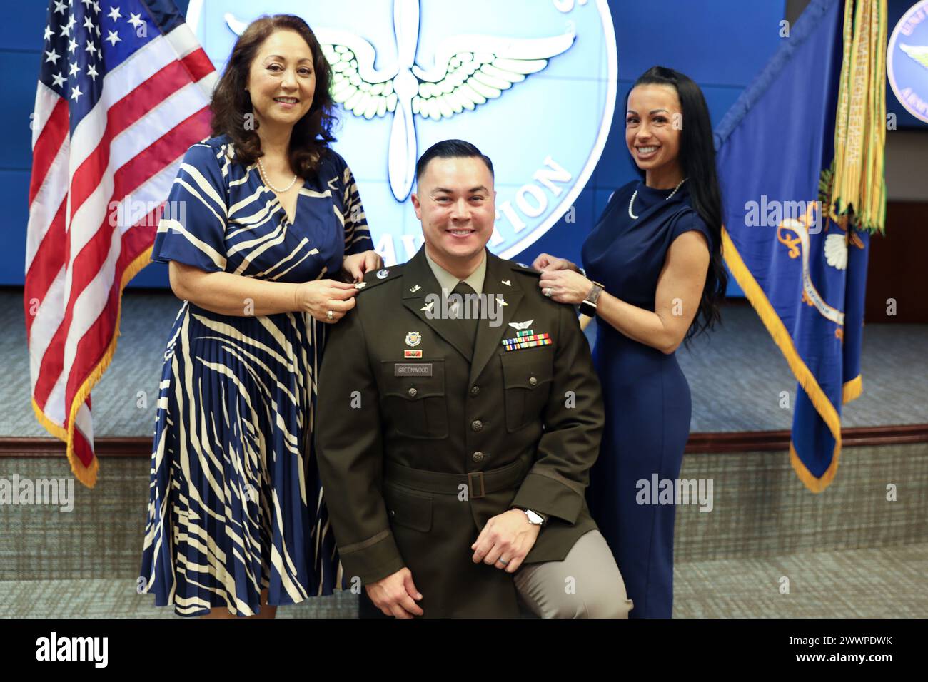 Maj. Bryce R. Greenwood's gold oak leaf clusters are pinned onto his ...
