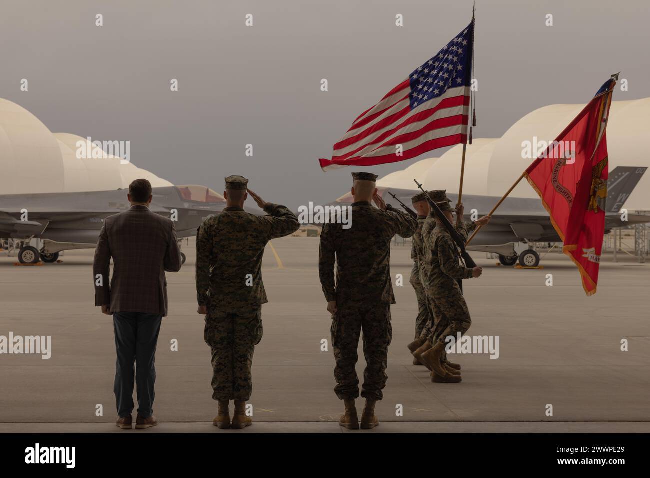 U.S. Marines Lt. Col. Christopher J. Kelly, middle, outgoing commanding ...