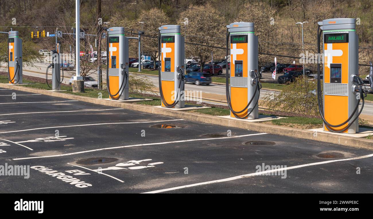 Electric vehicle charging stations in a parking lot Stock Photo - Alamy