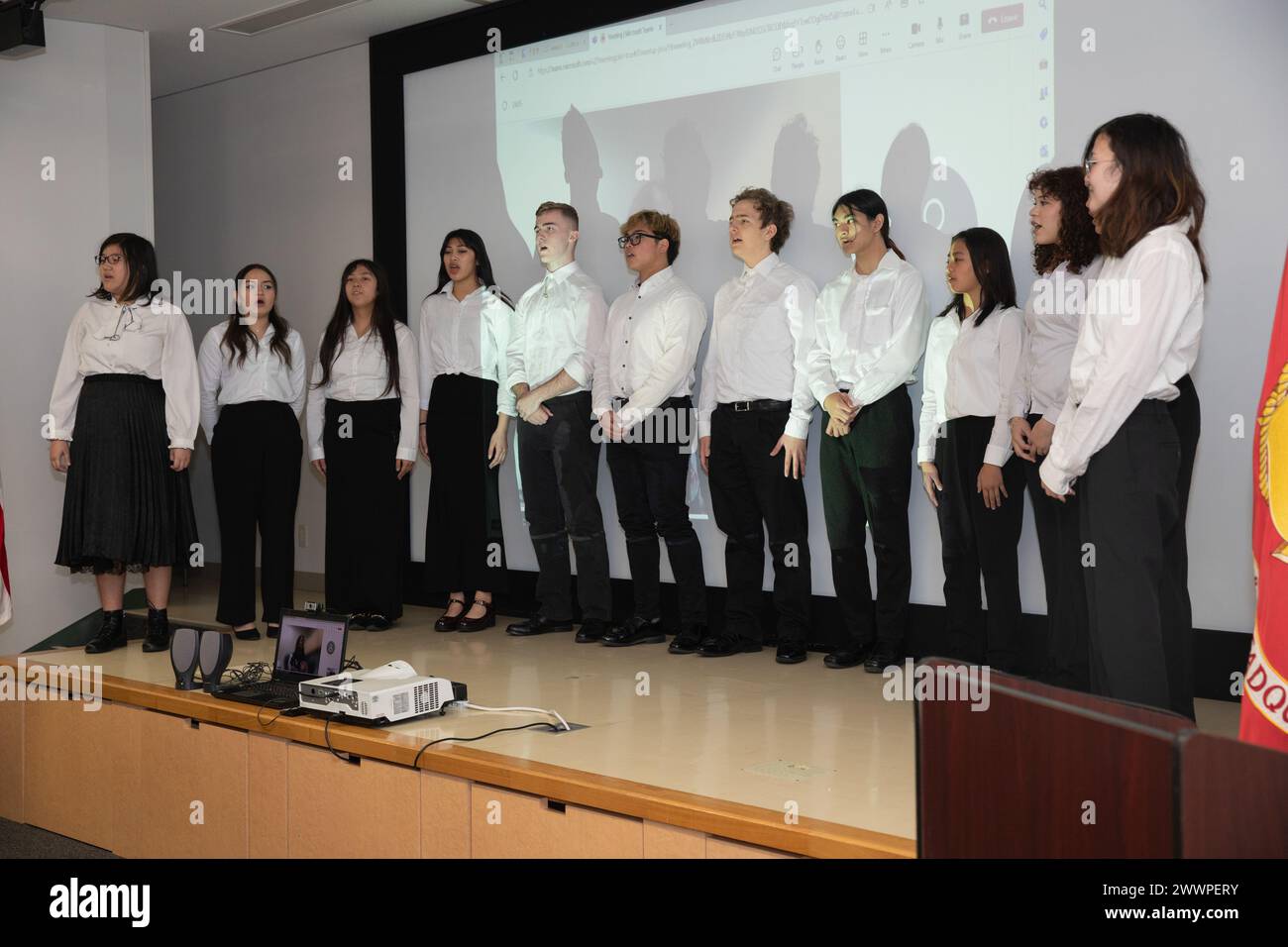 Students from Matthew C. Perry High School sing the U.S. national ...