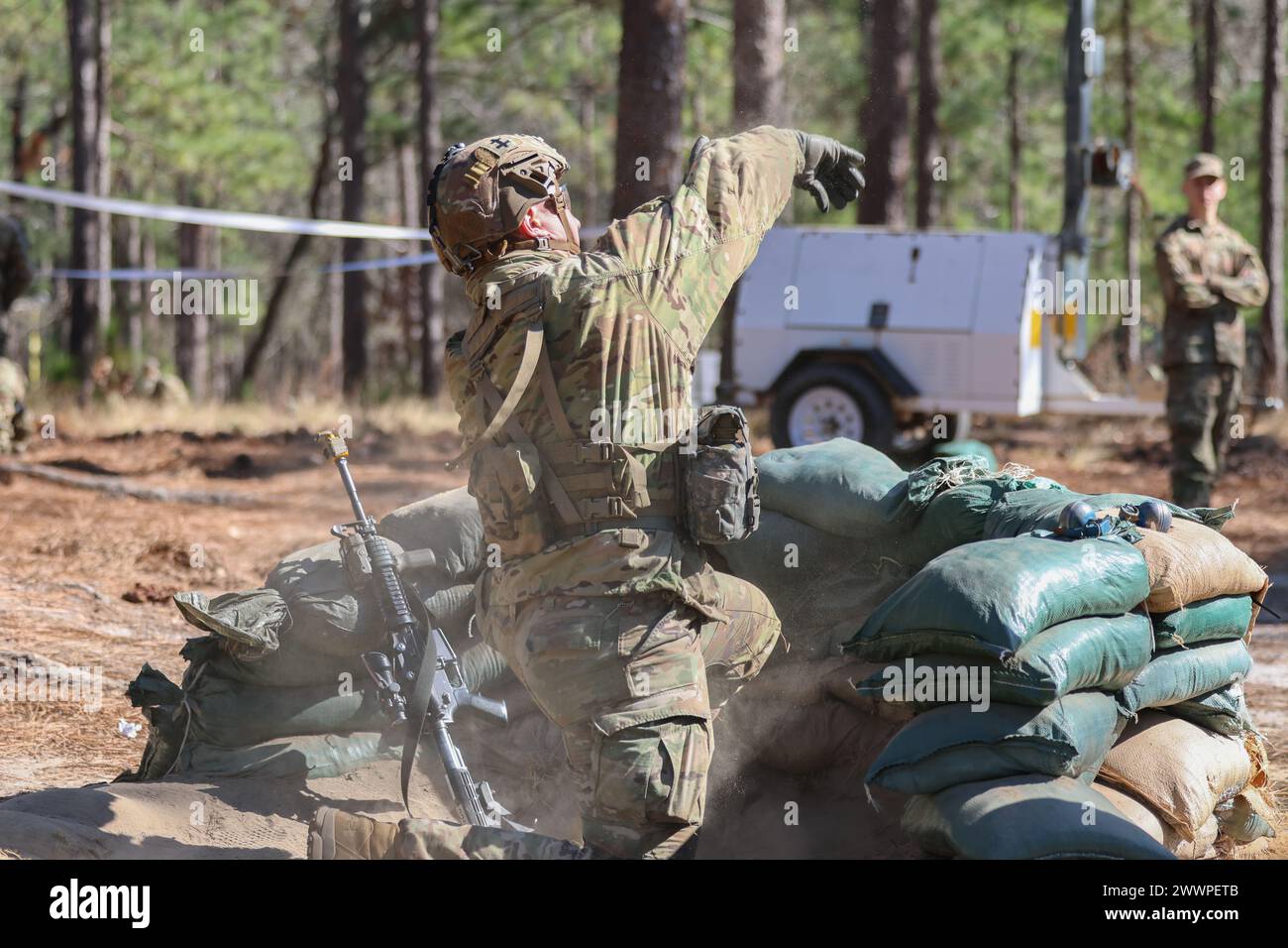 A U.S. Army soldier assigned to the 82nd Airborne Division throws an ...