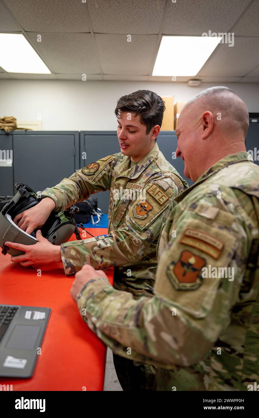 Chief Master Sgt. Justin Apticar (right), 19th Air Force command chief ...