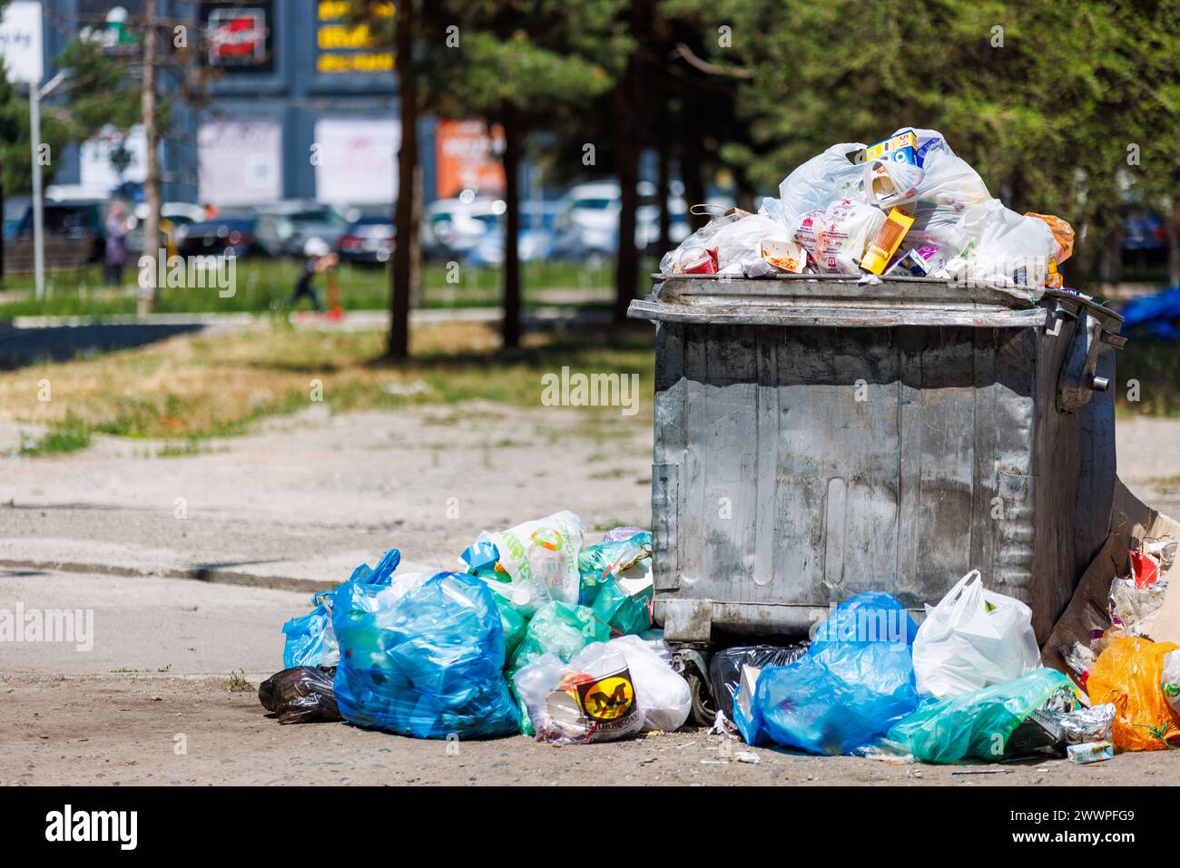 overfilled public trash bins at summer day in Bishkek, Kyrgyzstan Stock ...