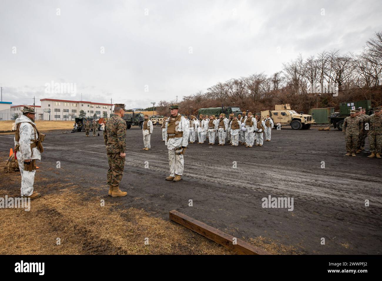 U.S. Marine Corps Brigadier General Adam Chalkley, center left, the ...
