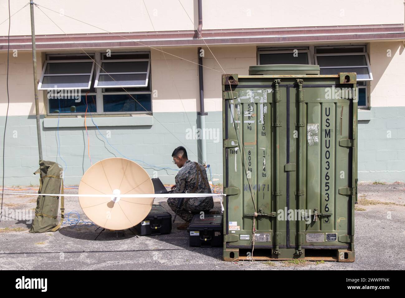 U.S. Marine Corps Sgt. Stetson Jansen, left, data systems administrator ...
