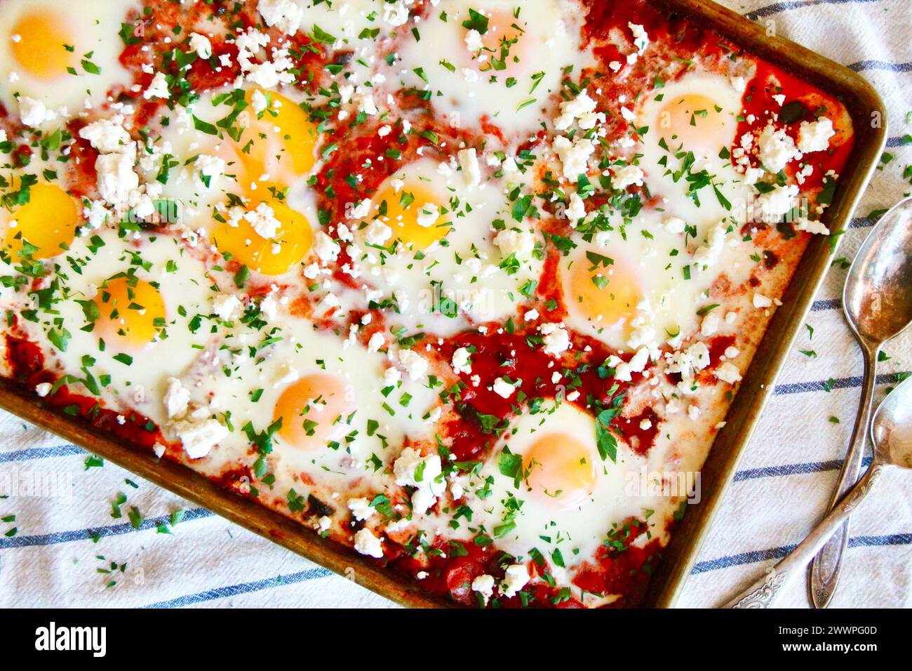 This image shows a larger adaptation of the Israeli dish shakshuka from ...