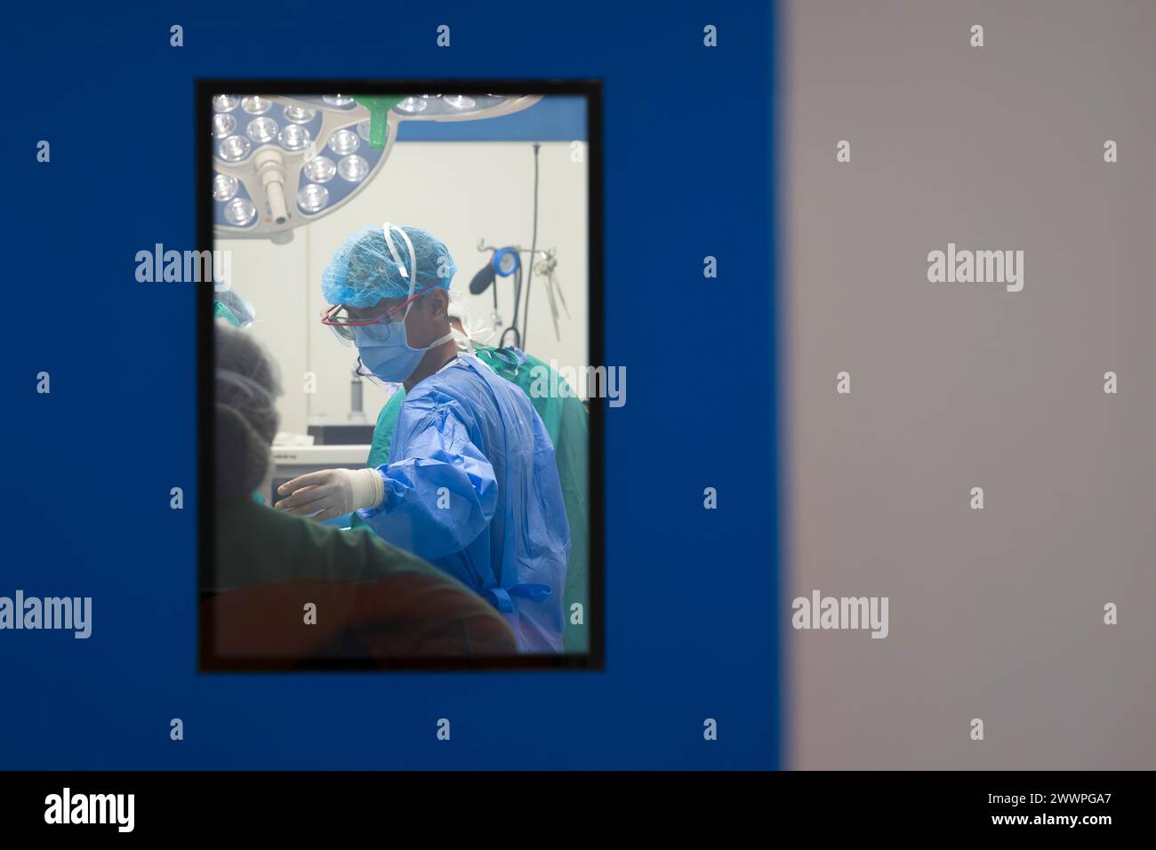 A technician reaches for an instrument during surgery inside a newly ...