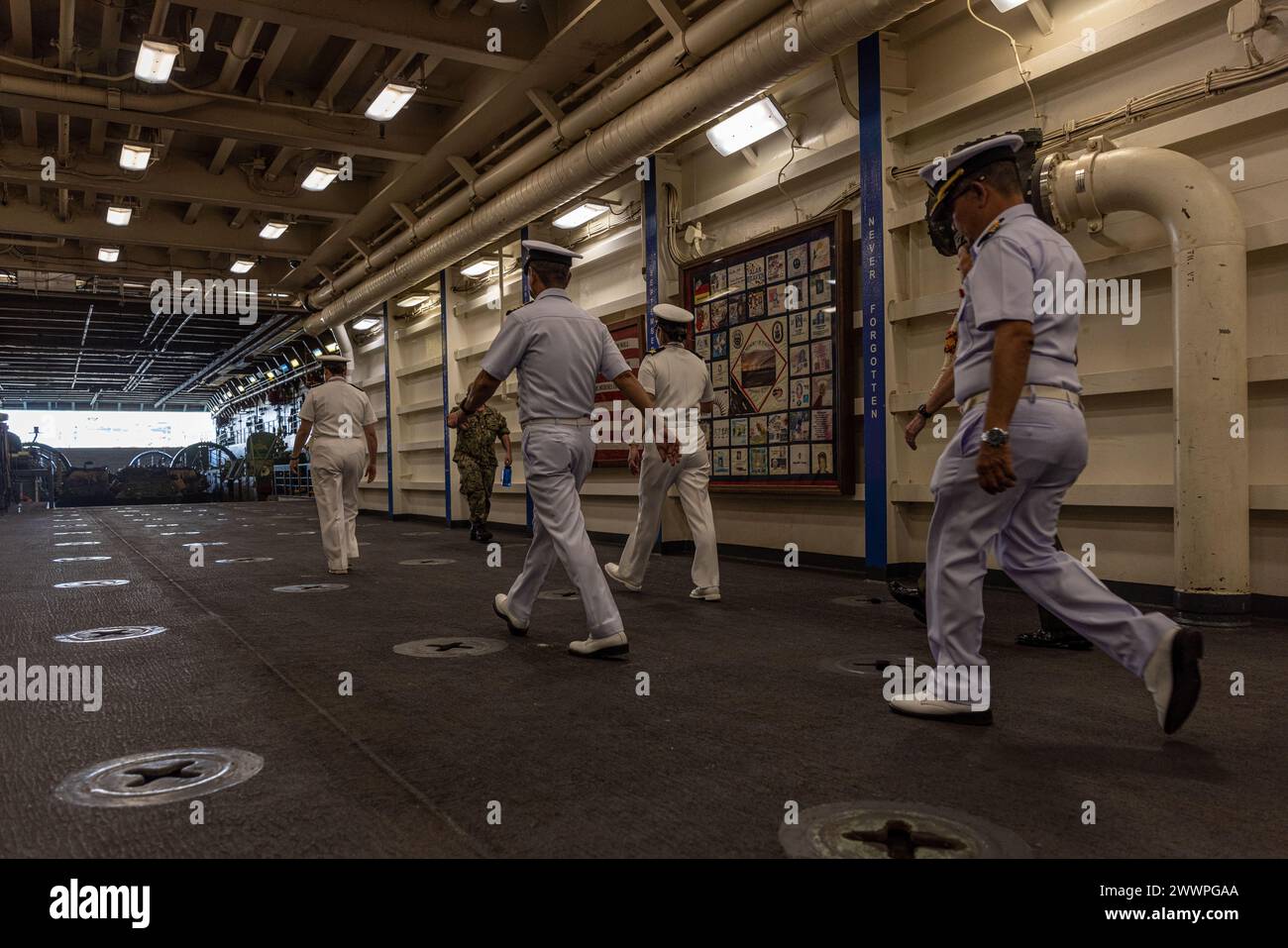 U.S. Navy Capt. Michel Brandt, back, commanding officer of the ...