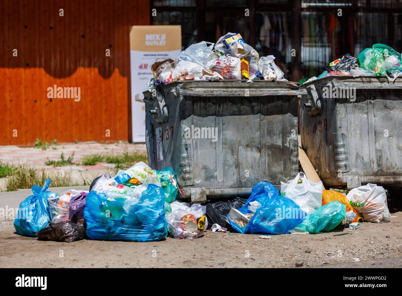 overfilled public trash bins at summer day in Bishkek, Kyrgyzstan Stock ...