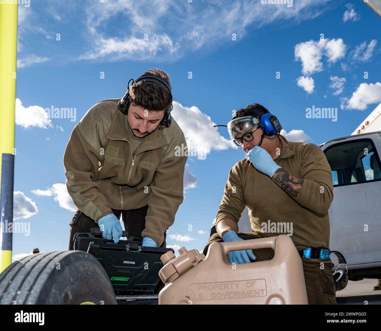 U.S. Air Force Airmen prepare gear for an aircraft-to-aircraft ...