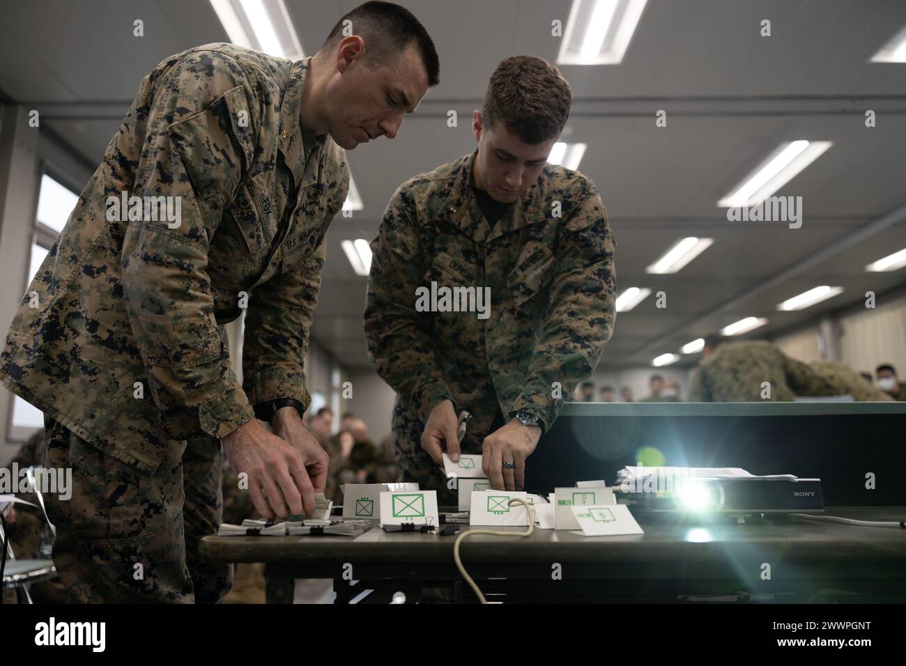 U.S. Marine Corps Maj. Zachary Fox, left, the current operations ...