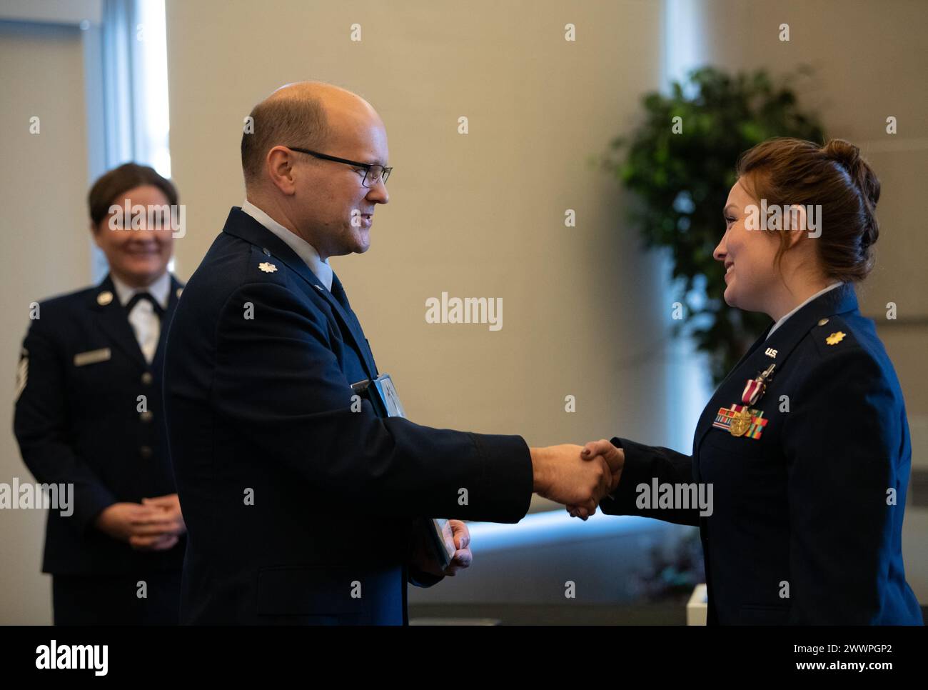 U.S. Air Force Lt. Col. Joshua McChesney and Maj. Lauren Carlisle ...