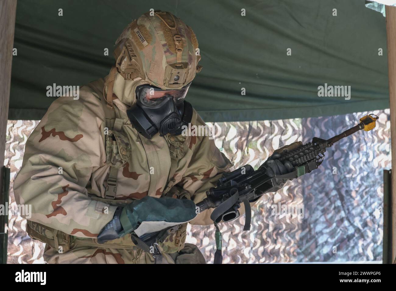 A U.S. Army soldier assigned to the 82nd Airborne Division demonstrates ...