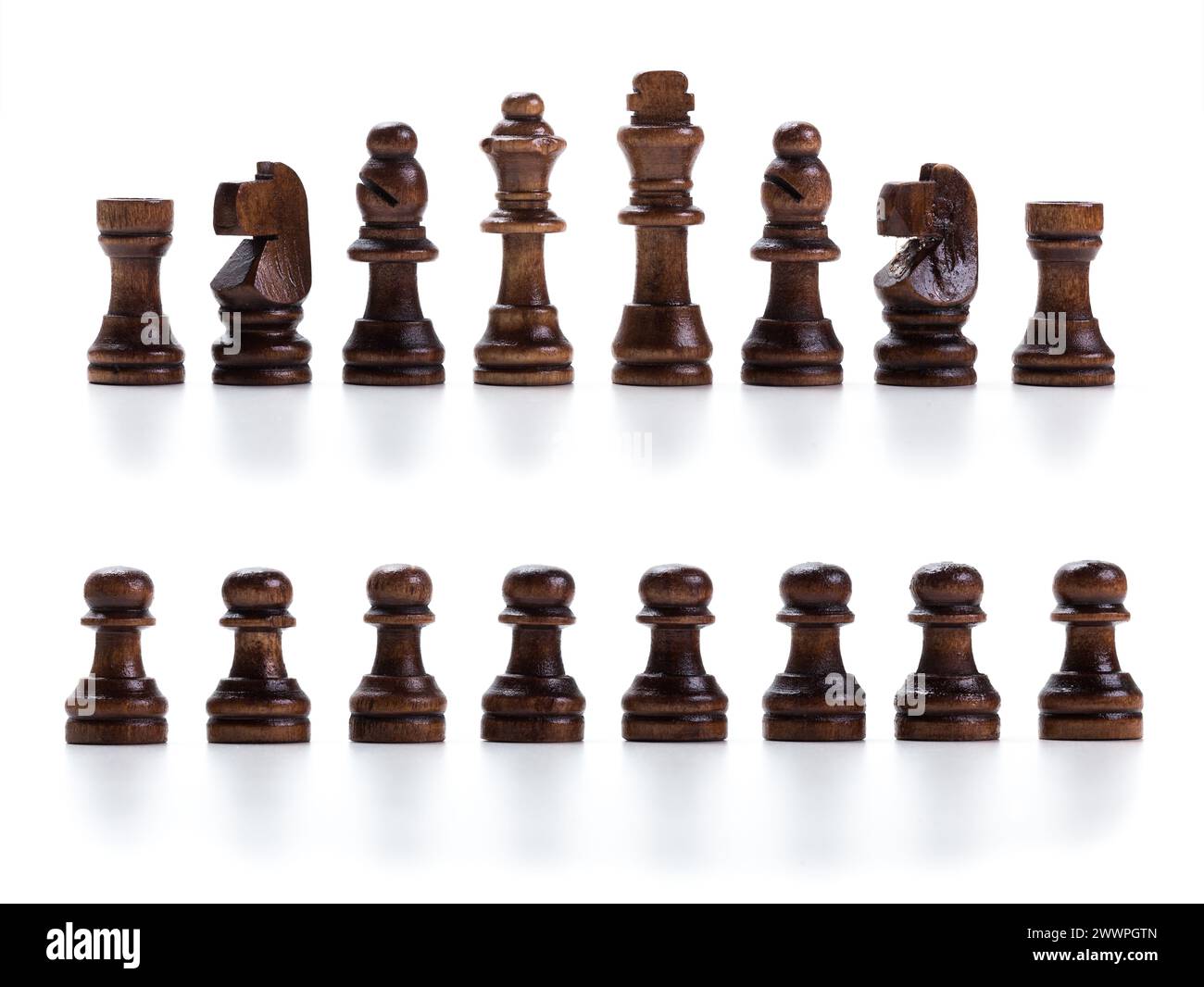 wooden chess set lined up in rows isolated Stock Photo - Alamy