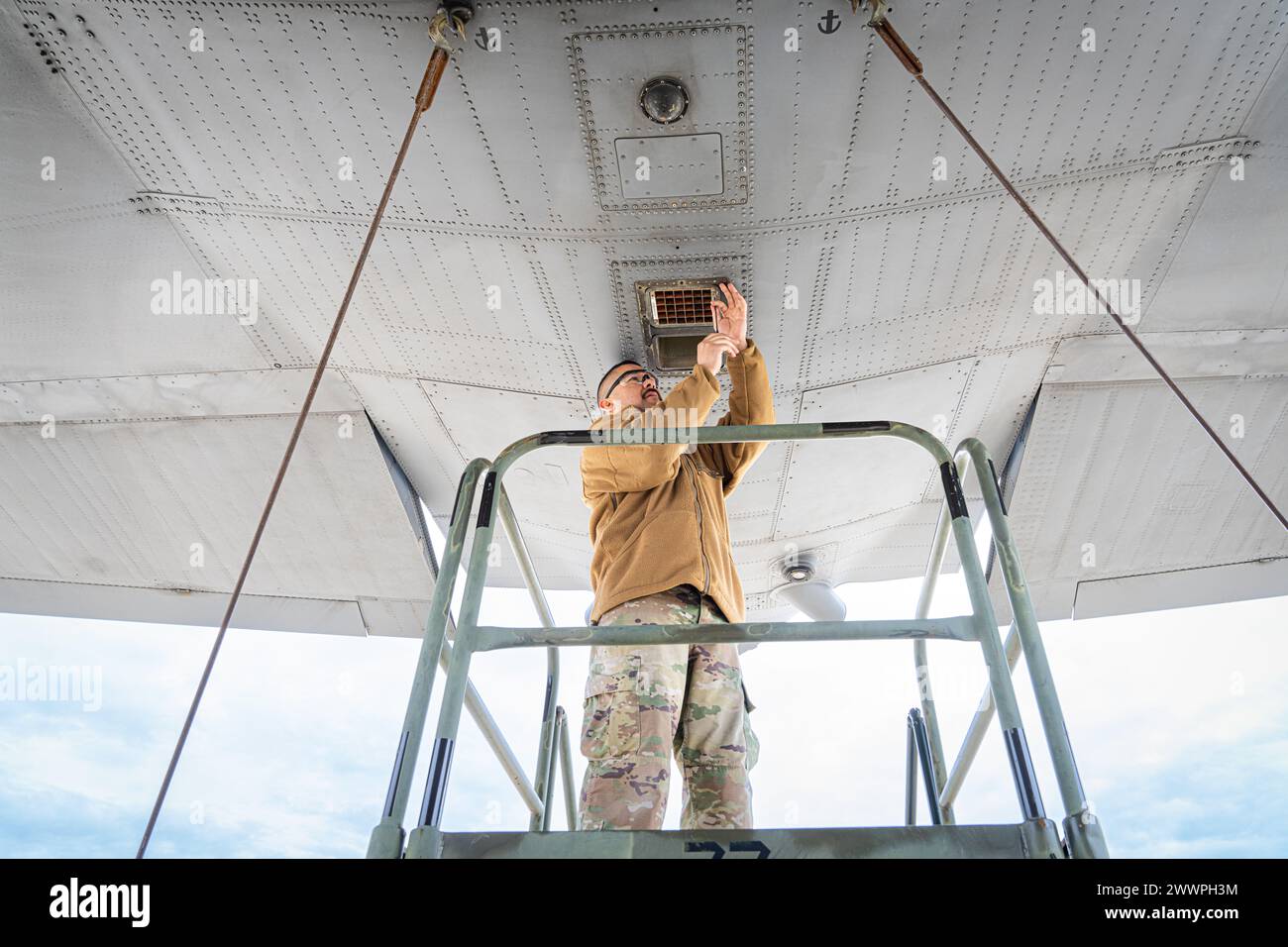 U.S. Airmen Master Sgt. Roberto Requena, a crew chief assigned to the ...