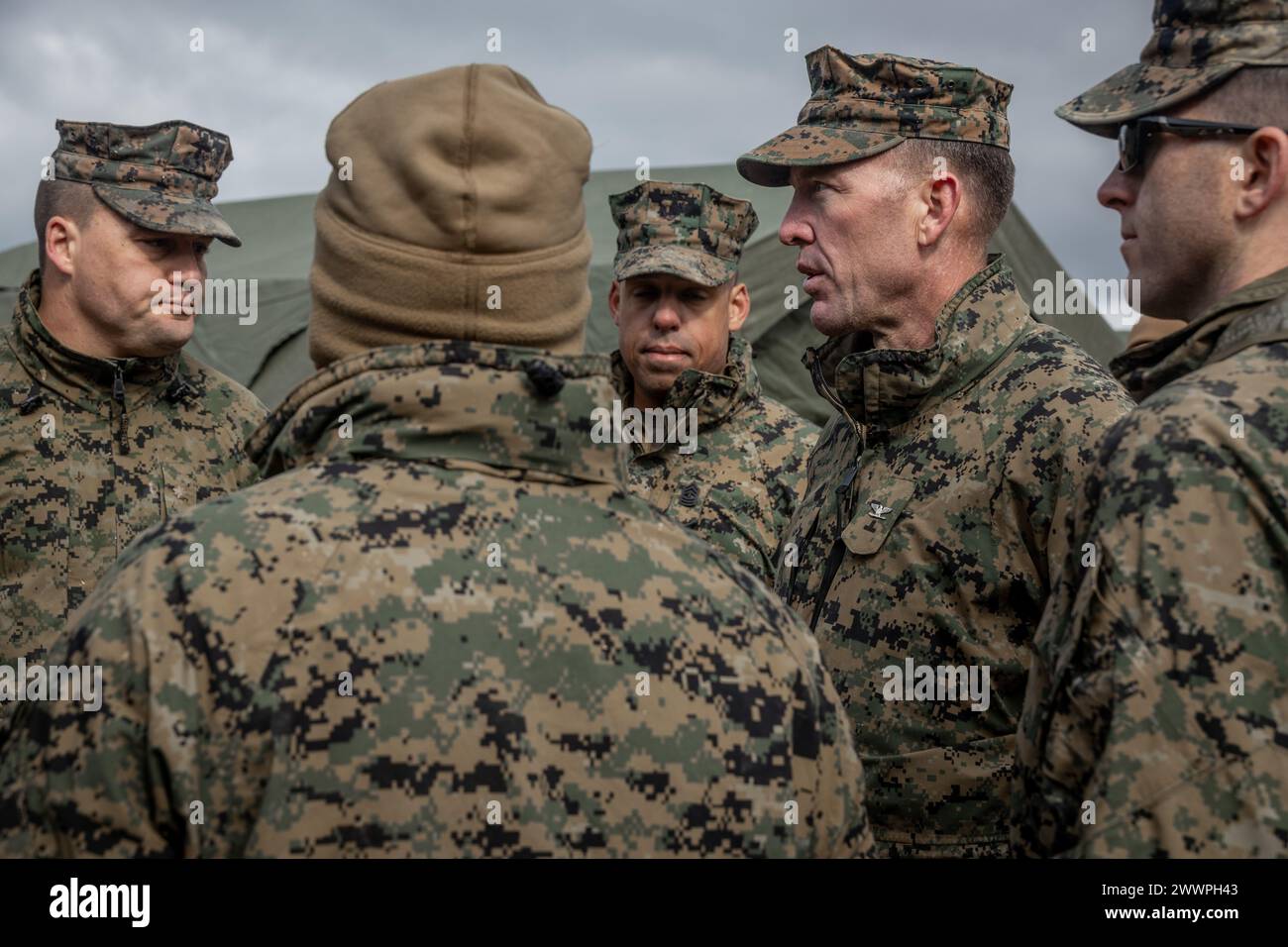 U.S. Marine Corps Col. Eric Dougherty, center right, the assistant ...