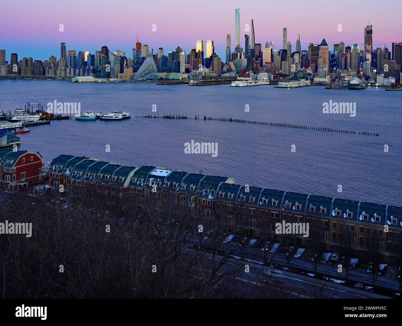 WEEHAWKEN, NJ -18 FEB 2024- Sunset view of the waterfront skyline in ...
