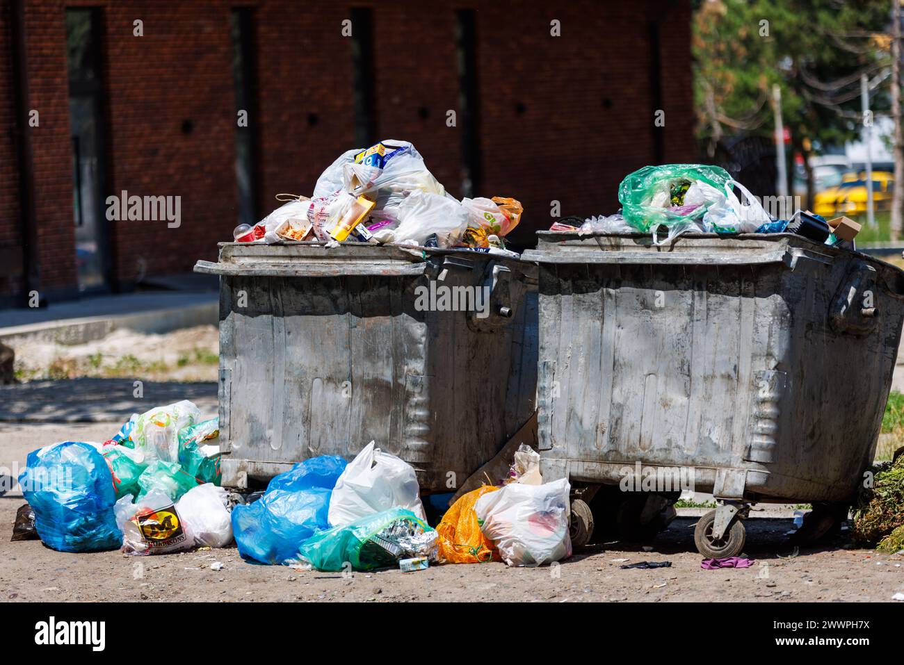 overfilled public trash bins at summer day in Bishkek, Kyrgyzstan Stock ...
