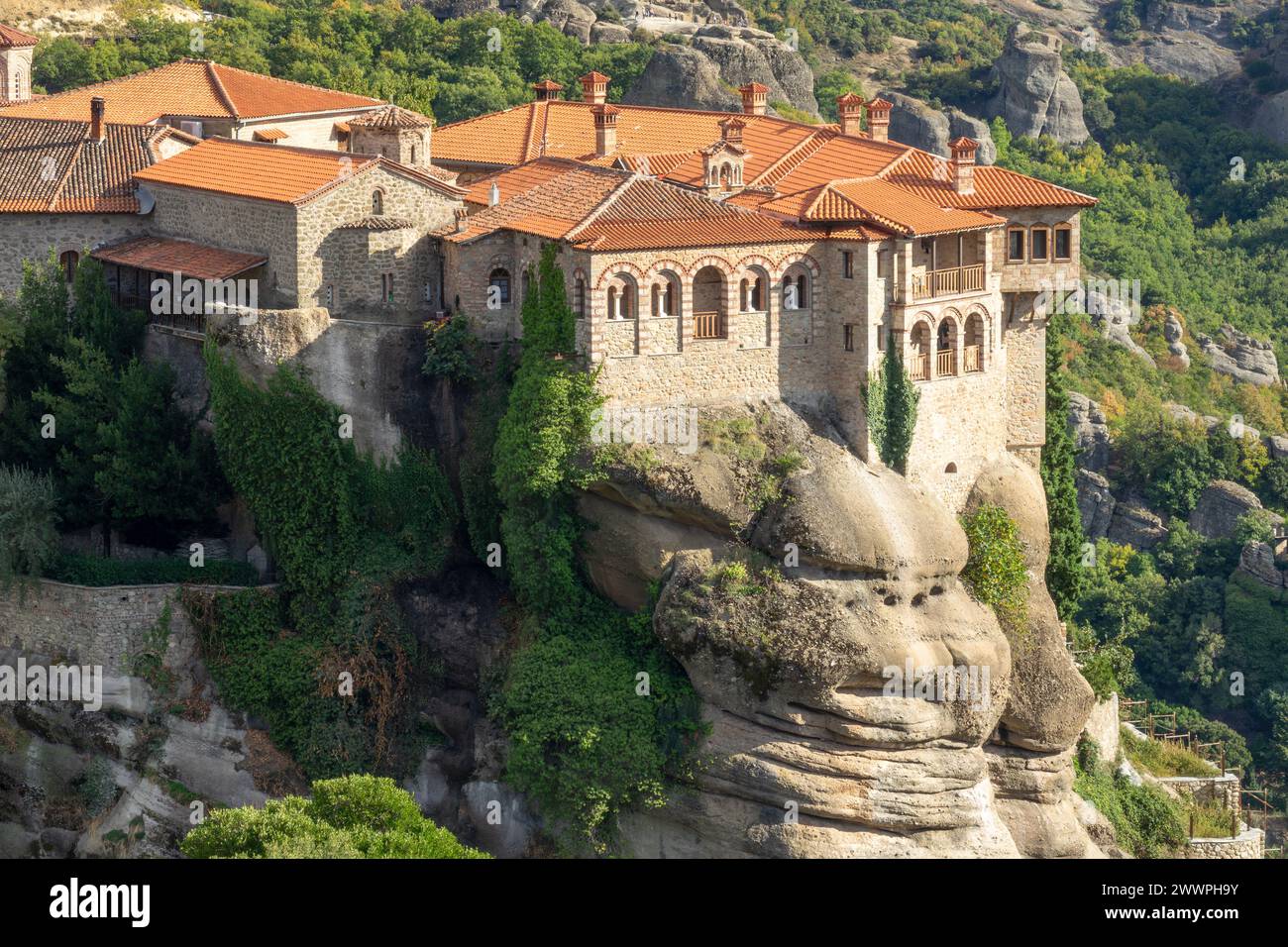 Greece. Sunny summer day in Kalambaka. Rock monastery with red roofs ...