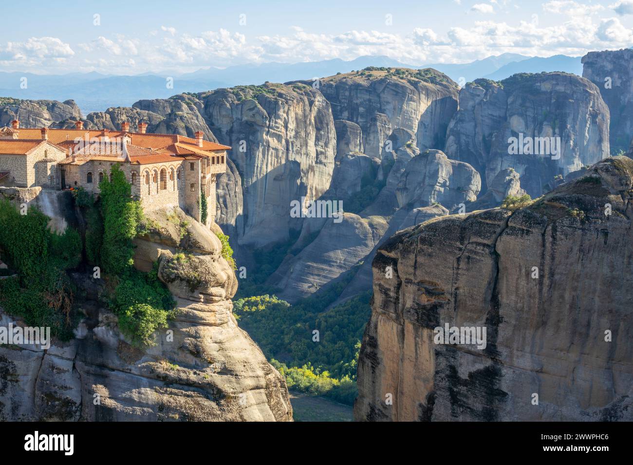Greece. Sunny summer day in Kalambaka. Rock monastery with red roofs ...
