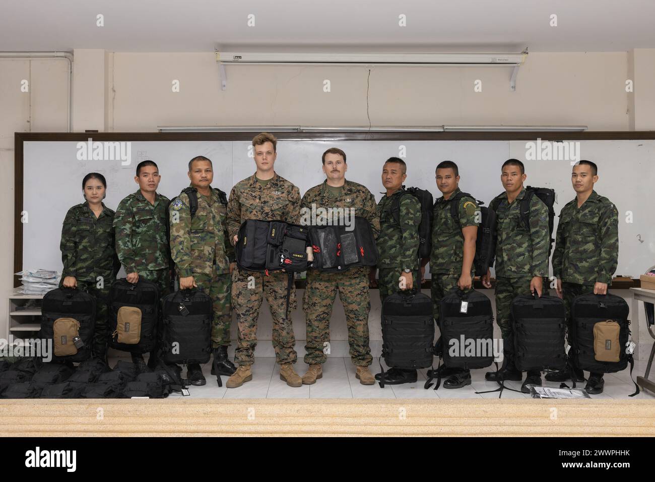 U.S. Marine Corps Gunnery Sgt. Pierce Draper, center right, the ...