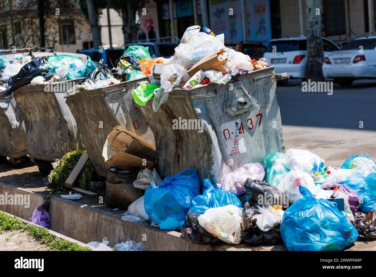 overfilled public trash bins at summer day in Bishkek, Kyrgyzstan Stock ...
