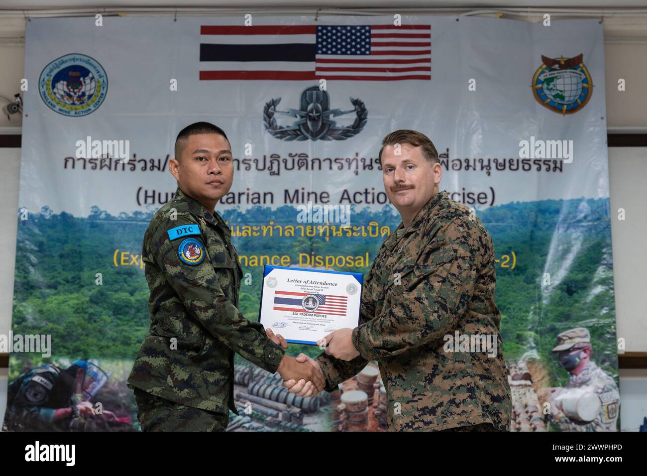 U.S. Marine Corps Gunnery Sgt. Pierce Draper, right, the Humanitarian ...