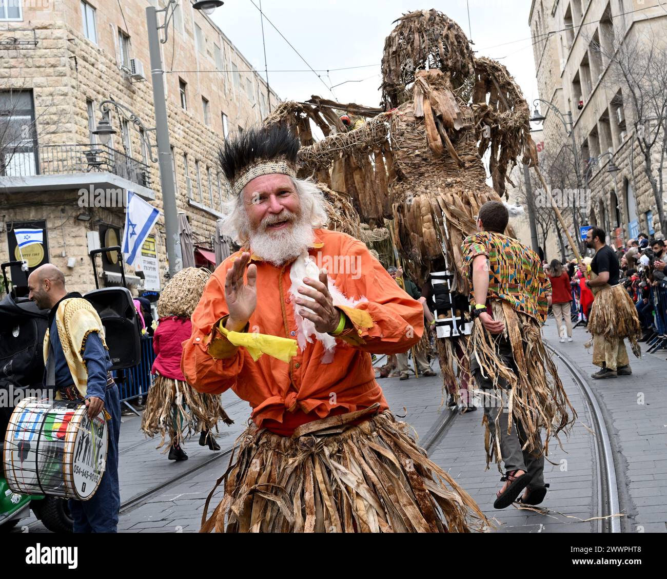 Jerusalem, Israel. 25th Mar, 2024. A man wears a costume and dances in ...