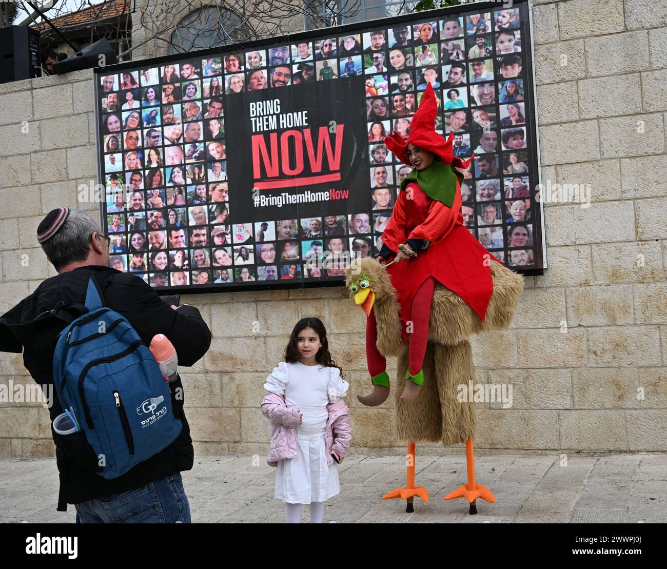Jerusalem, Israel. 25th Mar, 2024. People wear costumes in front of a ...