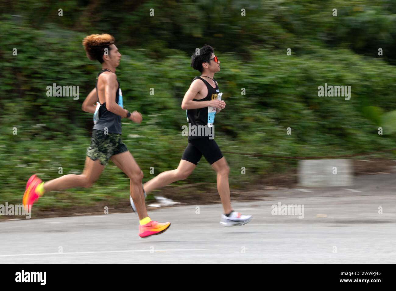 Runners participate in the Okinawa Marathon at Kadena Air Base, Japan ...
