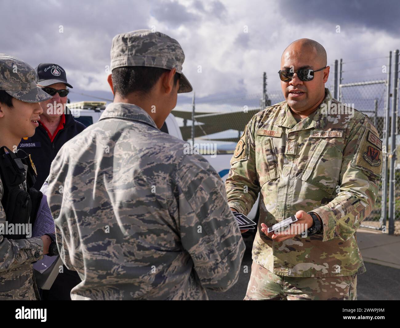 U.S. Air Force Tech Sgt. James Tullis, 9th Security Forces Squadron kennel master, presents a ...