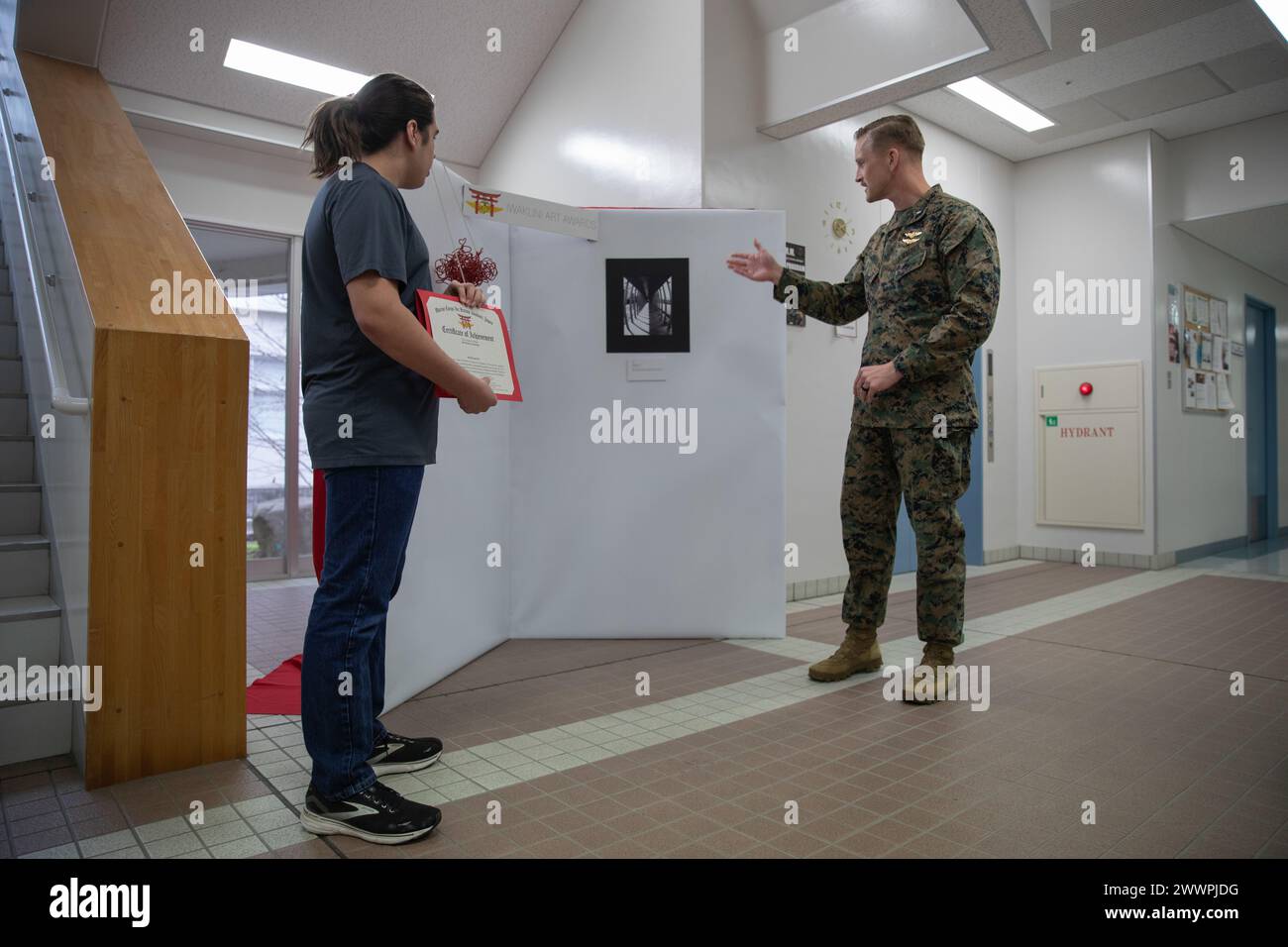 A student from Matthew C. Perry High School, left, describes his ...