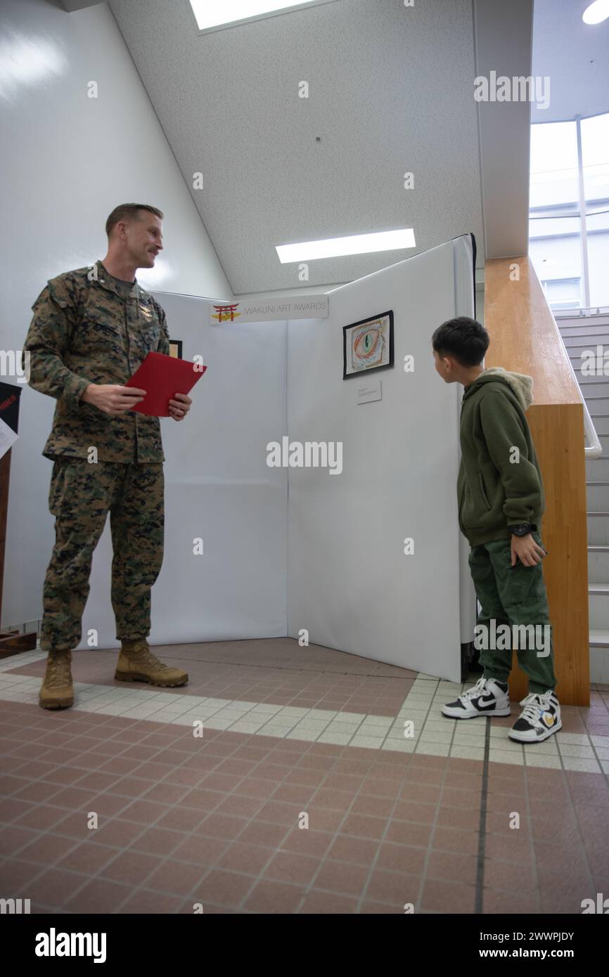 A student from Matthew C. Perry Intermediate School, left, describes ...