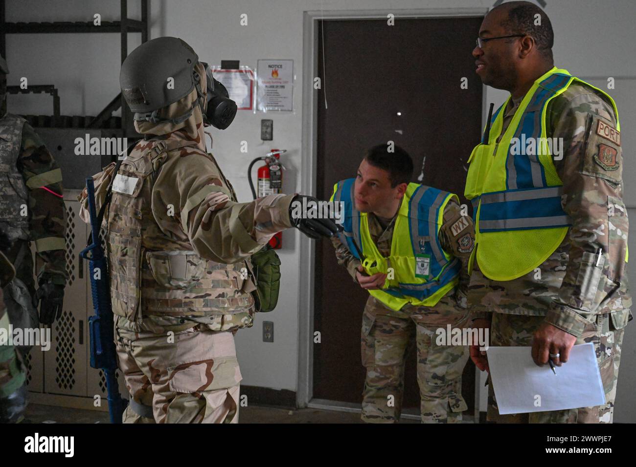 Team Little Rock Airmen Wing Inspection Team members look over Airmen ...