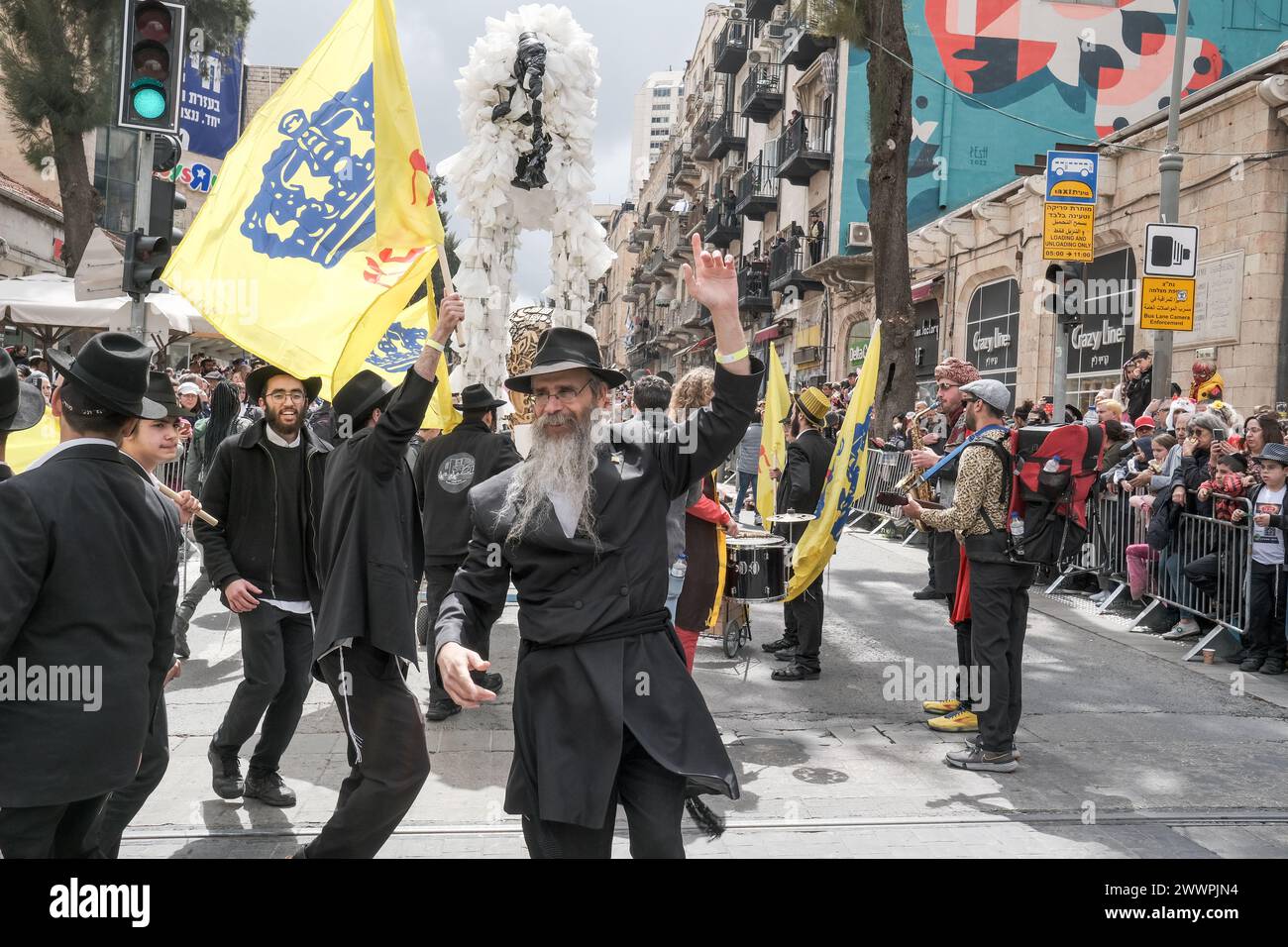 Jerusalem, Israel. 25th March, 2024. Spectators in costumes line along ...