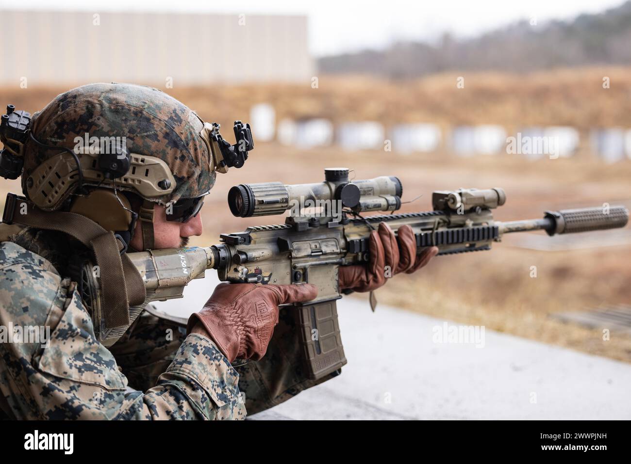 U.S. Marine Corps Cpl. Taylor Benson sites in with an M27 Infantry ...