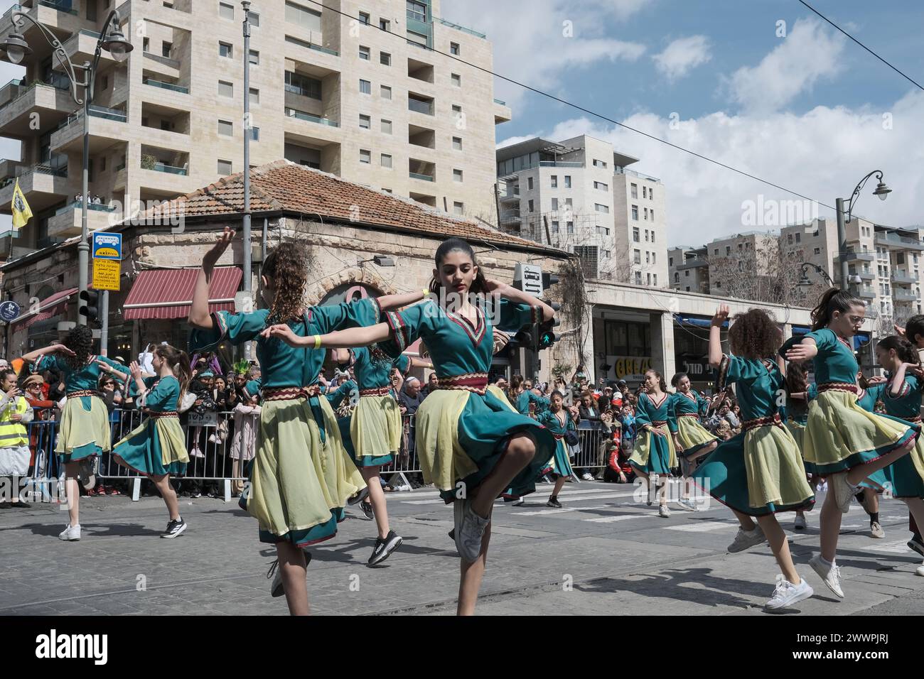 Jerusalem, Israel. 25th March, 2024. Spectators in costumes line along ...