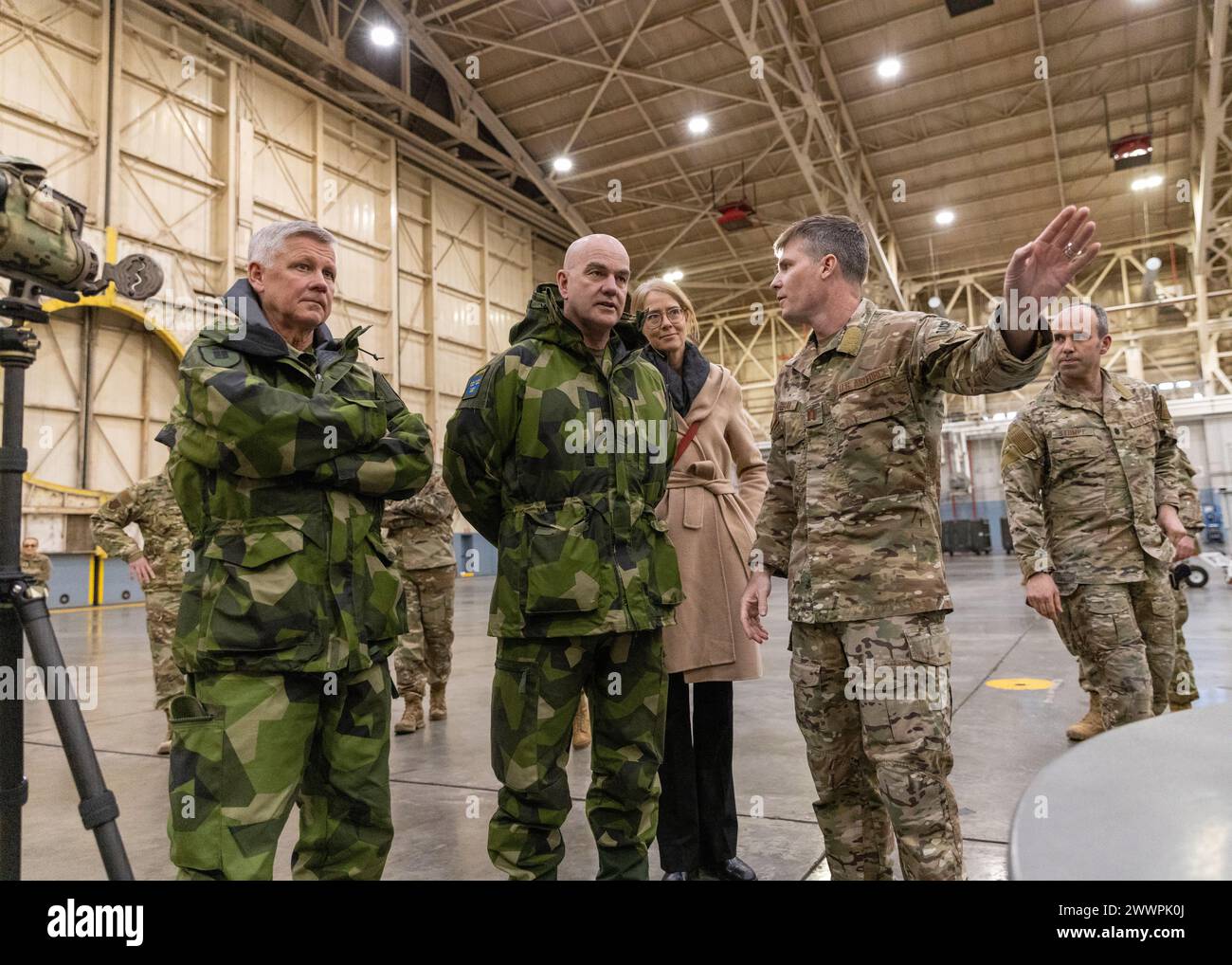 Swedish military and diplomatic representatives are briefed by a New ...