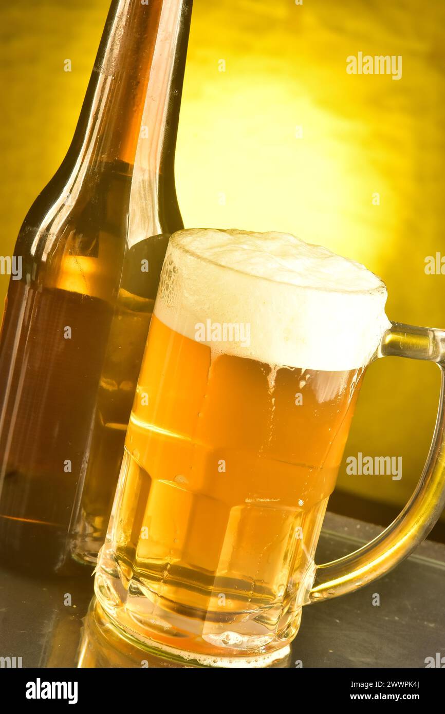 Beer mug on yellow background Stock Photo - Alamy