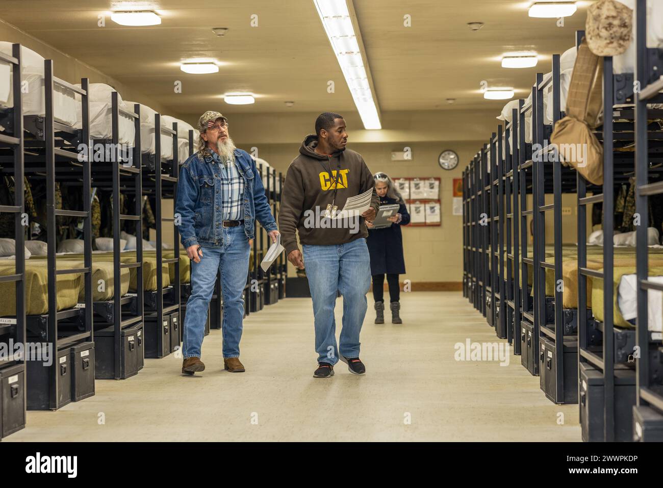 Personnel conduct an inspection at Officer Candidates School barracks ...