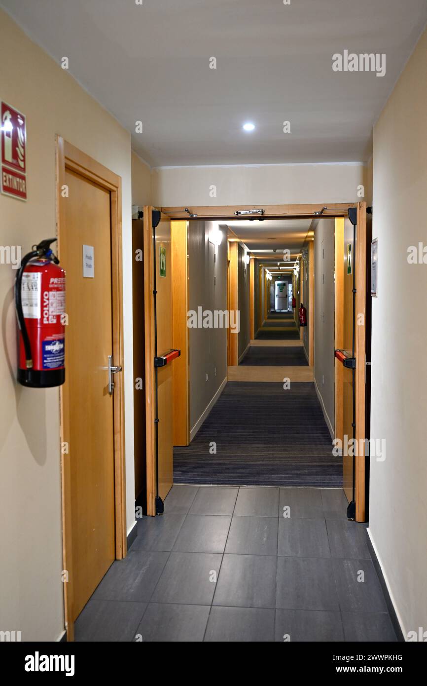 Long hallway receding into distance Stock Photo - Alamy