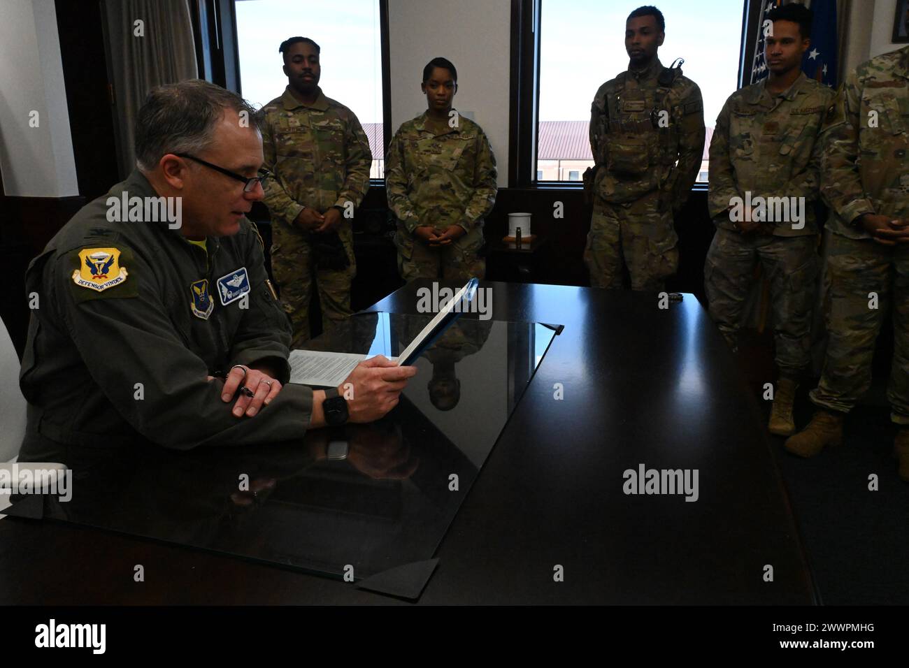 U.S. Air Force Col. Keith Butler, 509th Bomb Wing commander, reads the ...