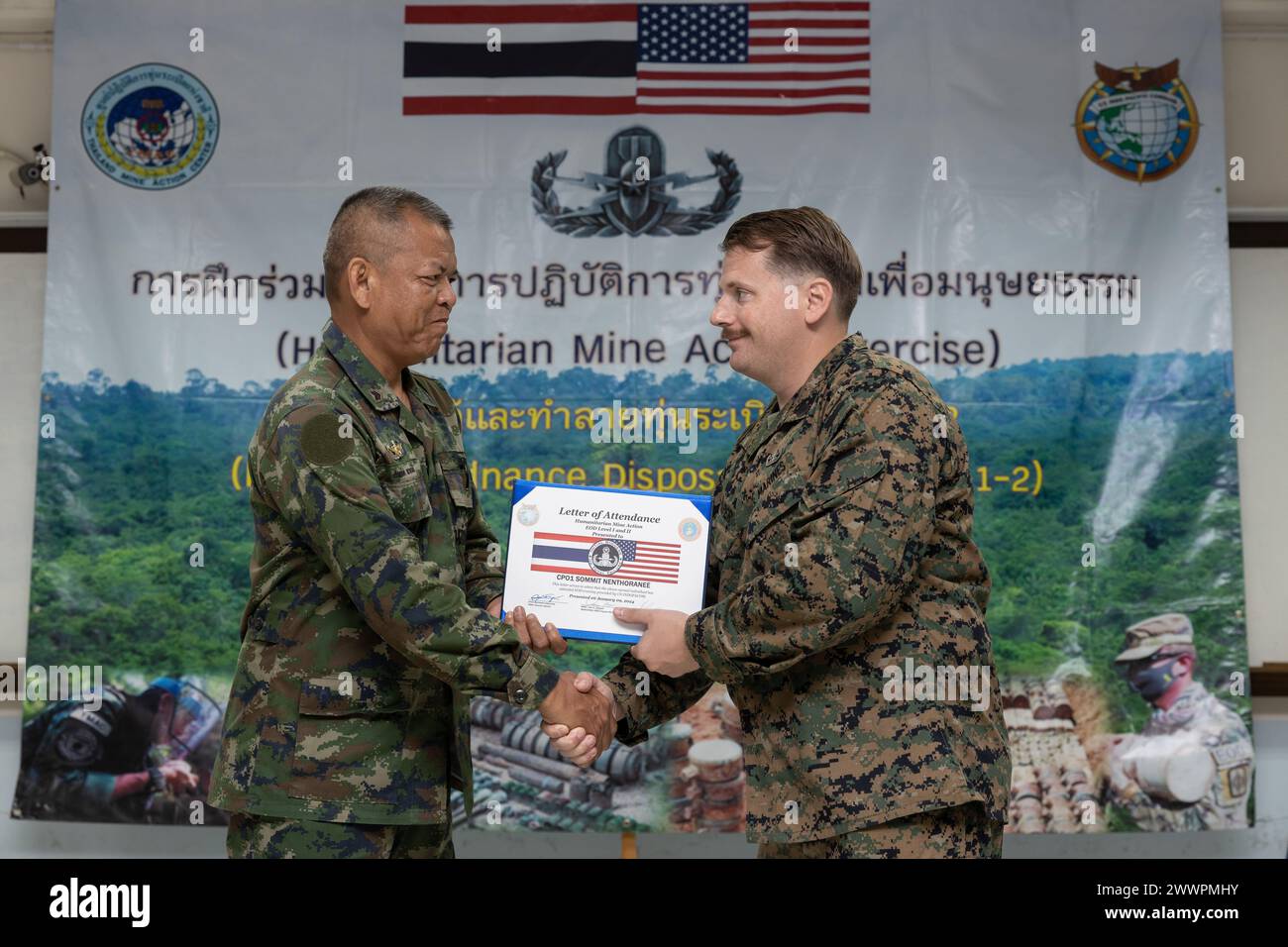 U.S. Marine Corps Gunnery Sgt. Pierce Draper, right, the Humanitarian ...