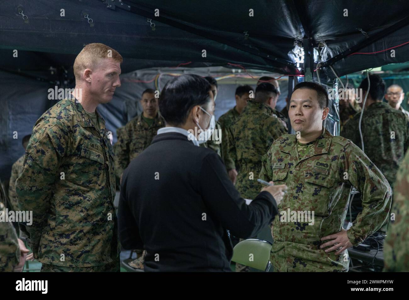 U.S. Marine Corps Lt. Col. Kirby Mills, left, operations officer with ...