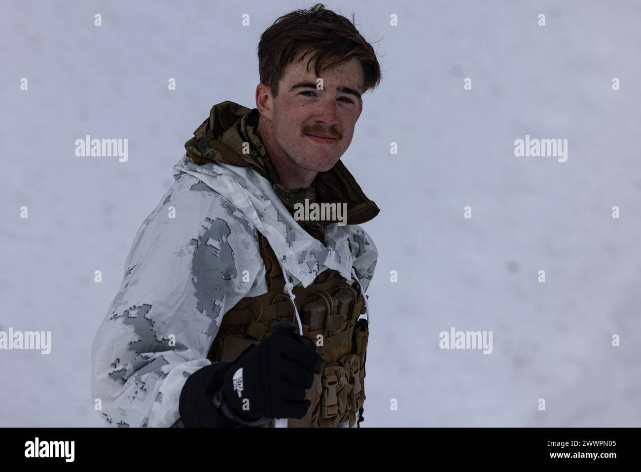 U.S. Marine Corps Sgt. Tyler Michaelson prepares to practice skiing ...